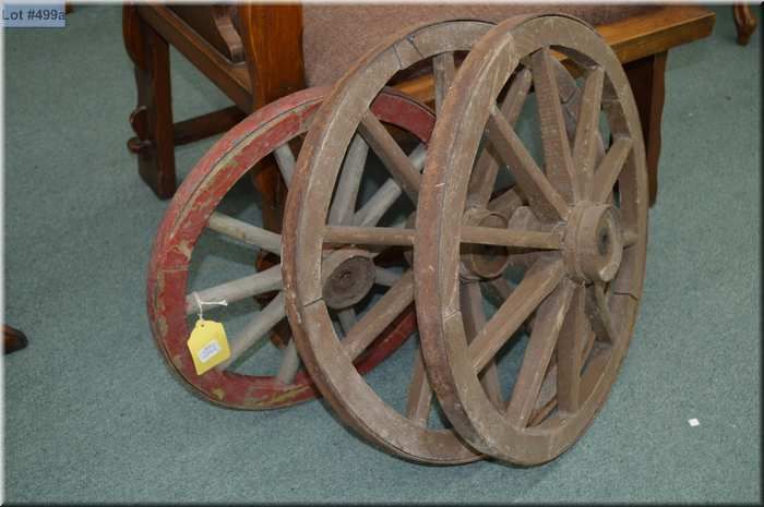 Three small vintage wagon wheels