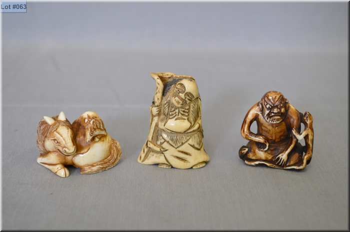 Three antique carved bone netsukes