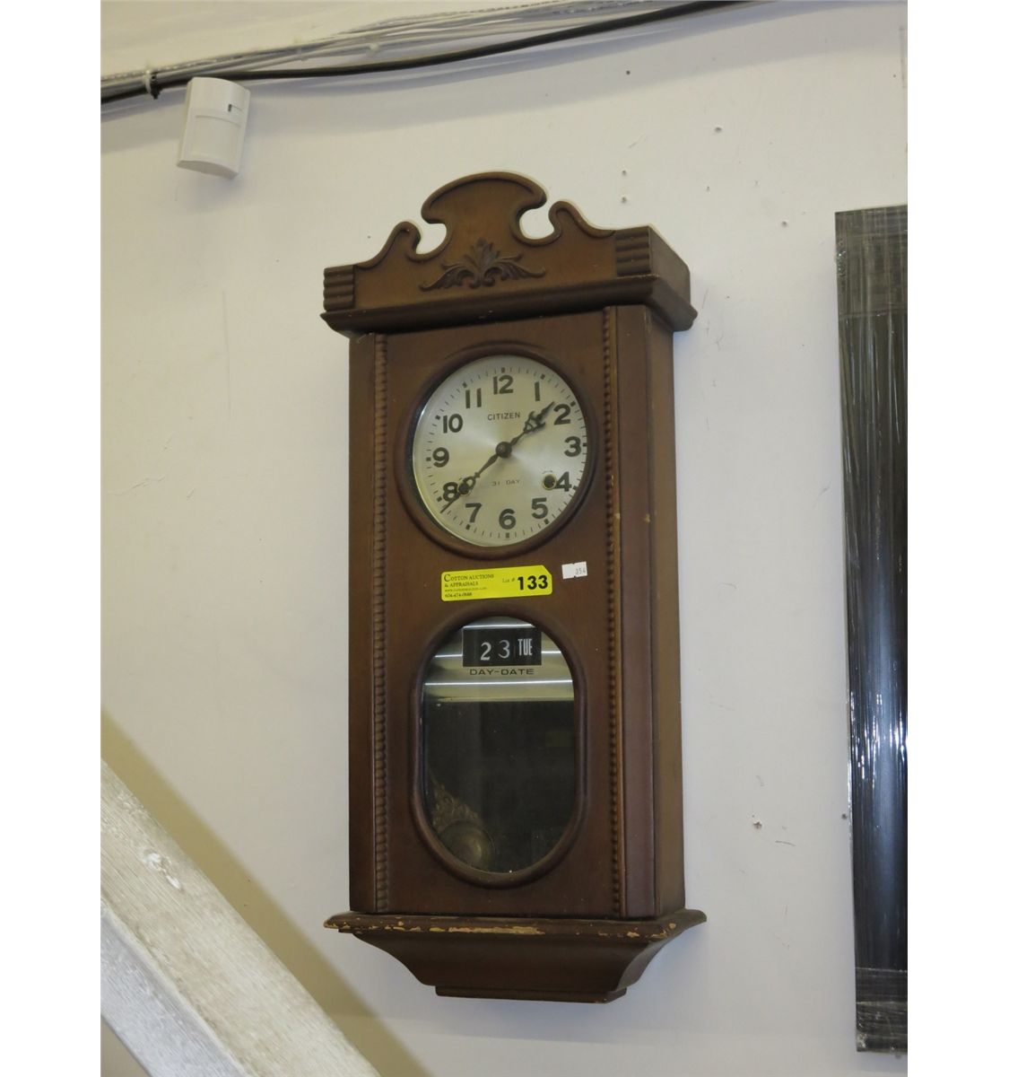 31 Day wall clock w/ Day/Date - wood cased