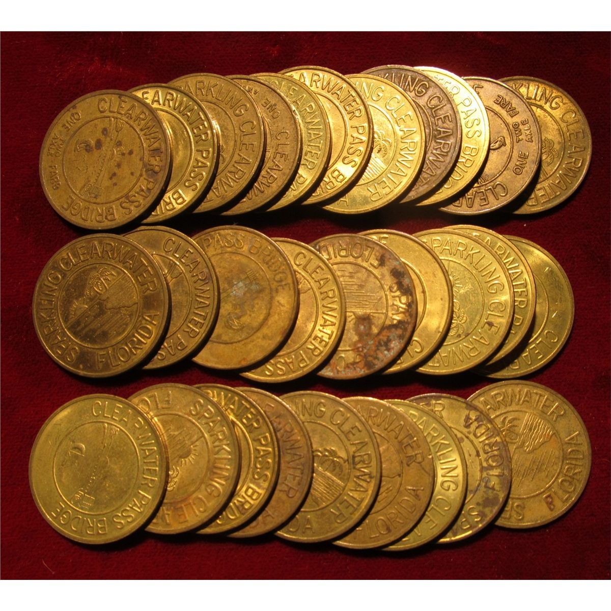 937. 29 brass Clearwater Pass Bridge two axle one fare tokens in a tube