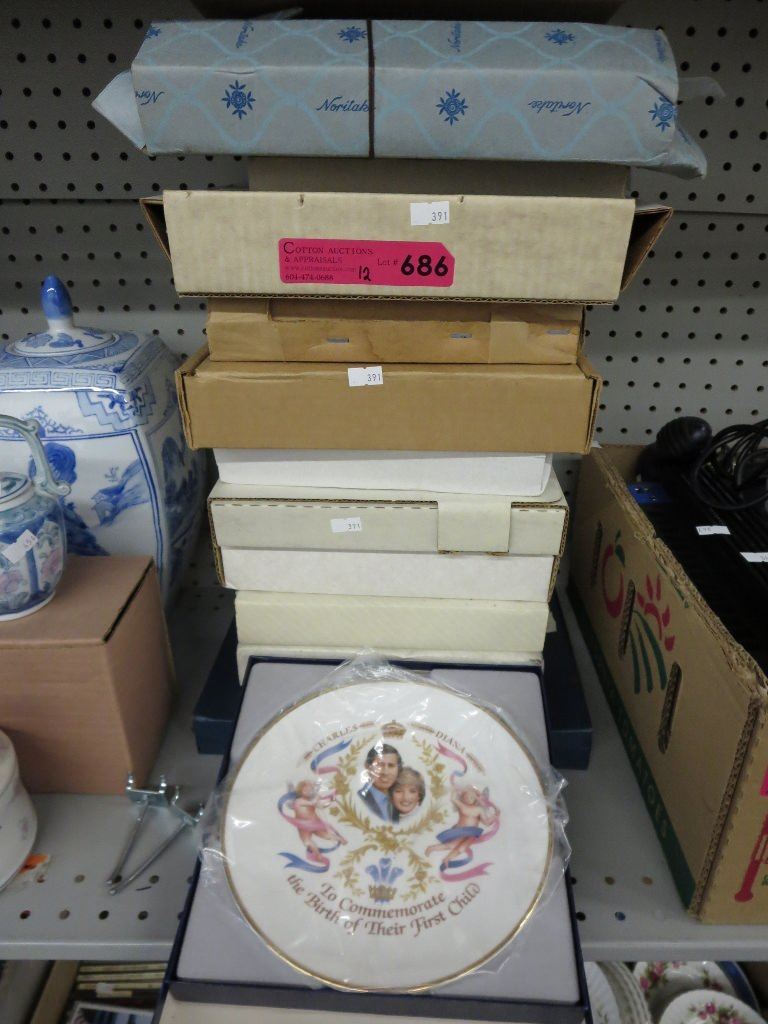 12 Collector plates in boxes.