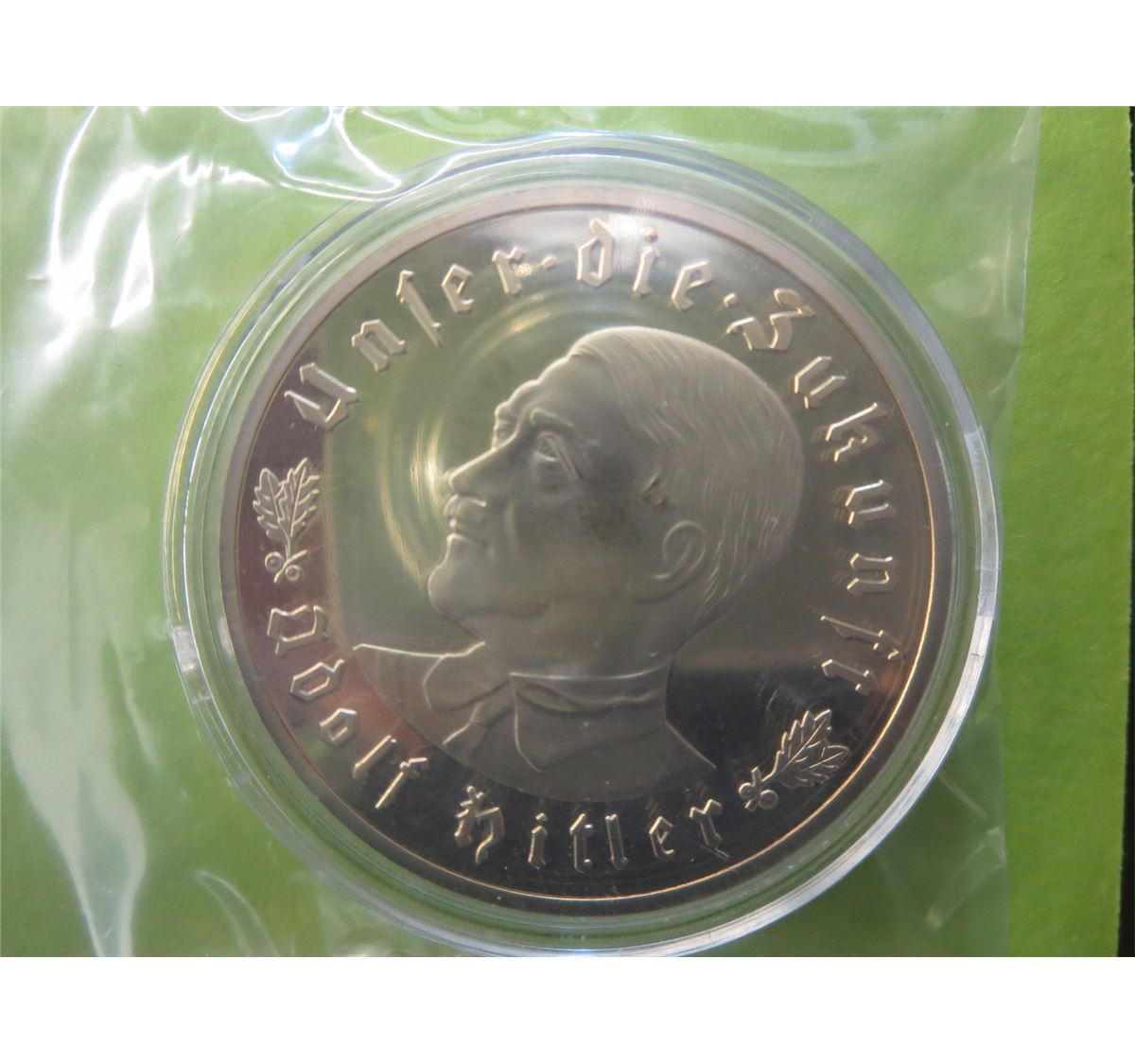 Gold finished Adolph Hitler coin in capsule