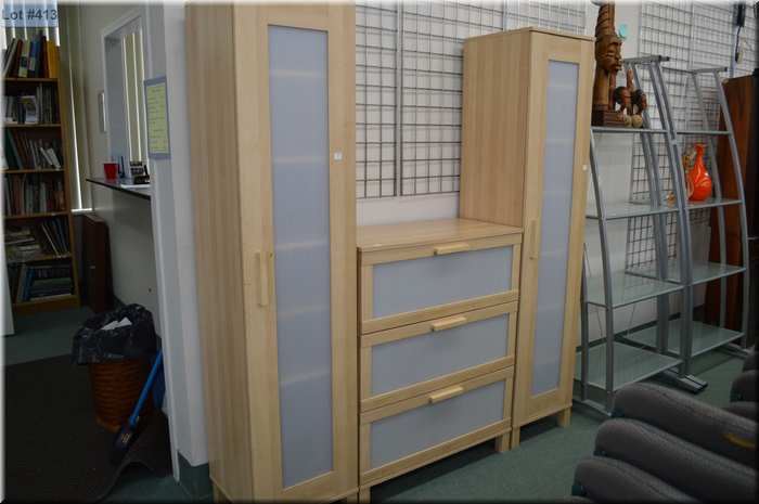 Three section modular Ikea wall unit with three drawers and two cupboards