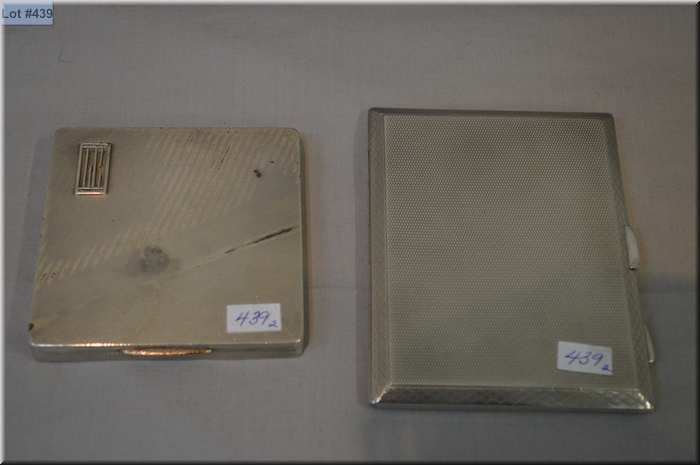 Two sterling silver cigarette cases both with British hallmarks