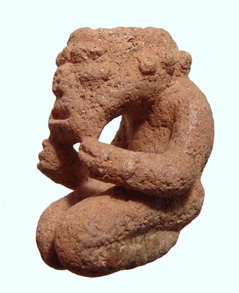 Costa Rican stone figure of a seated male