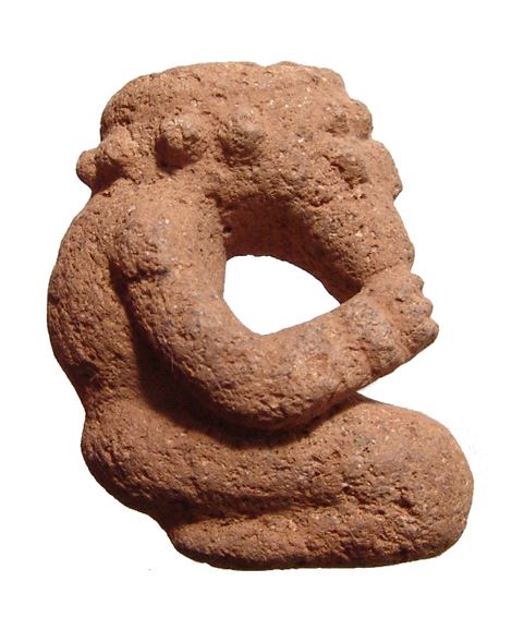 Costa Rican stone figure of a seated male