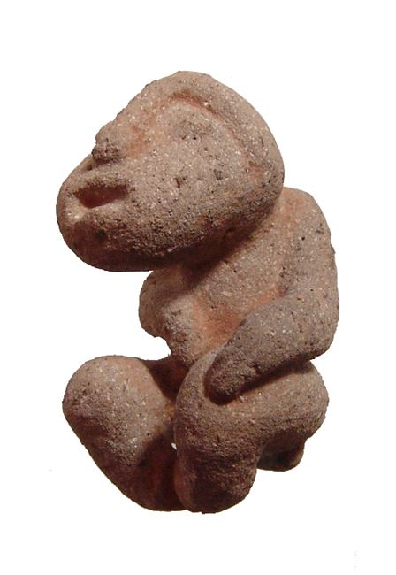 Costa Rican stone figure of a seated male