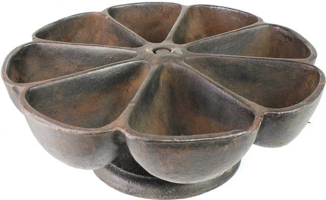 Antique cast iron revolving nail bin