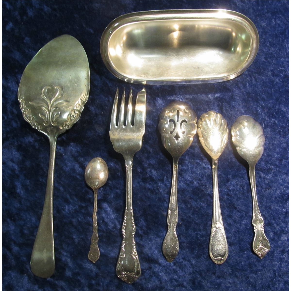 1368. (7) interesting pieces of silver plate flatware, largest piece ...