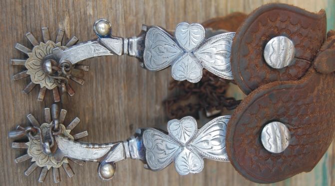inlaid cloverleaf spurs, marked with a small EG