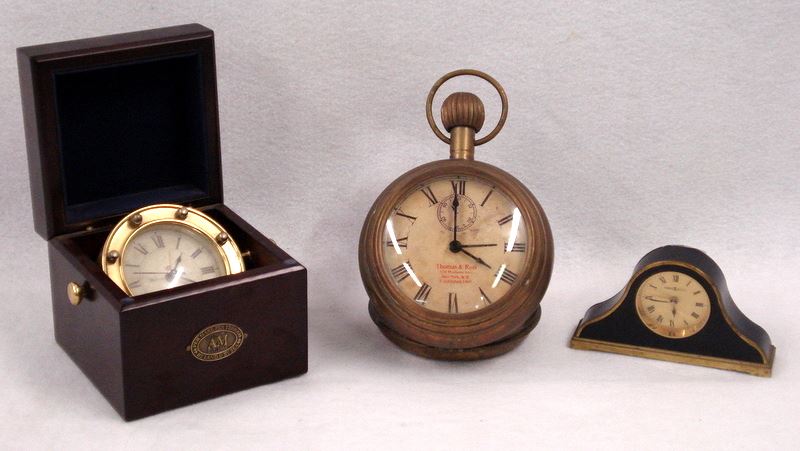 Lot of three battery operated novelty clocks/watches including a ...