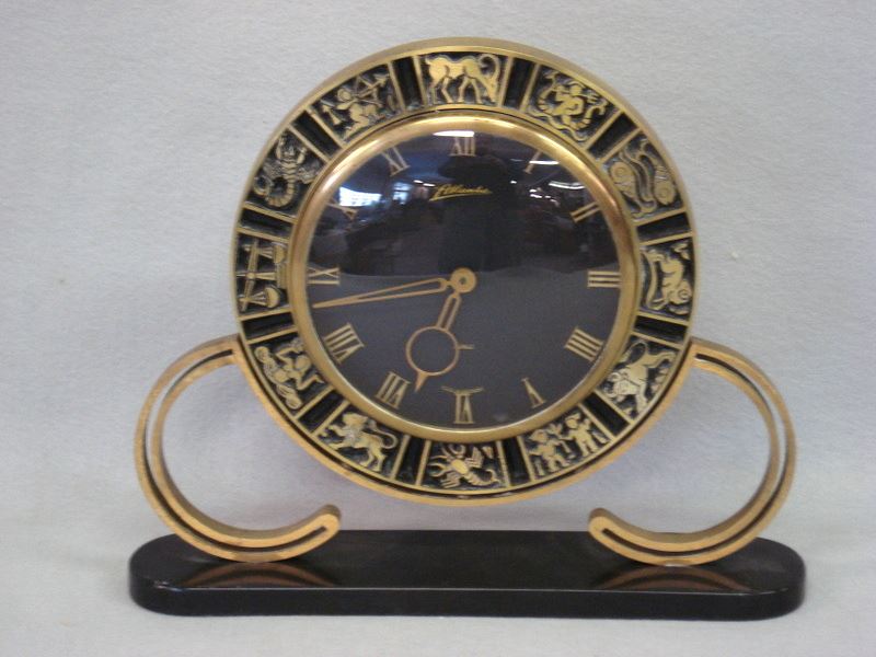 A German zodiac clock by F. Mauthe on black base, with brass roman ...