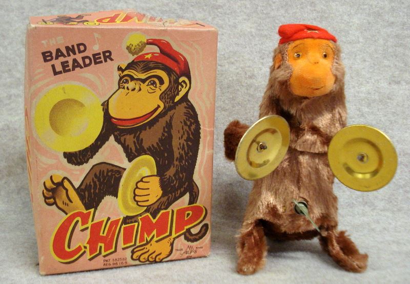 Six children's toys including a wind-up "Chimp the band leader" in ...