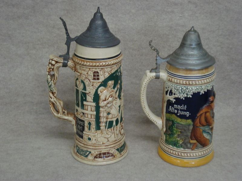 Five German beer steins with pewter lids ranging in size from 8" to 12 ...