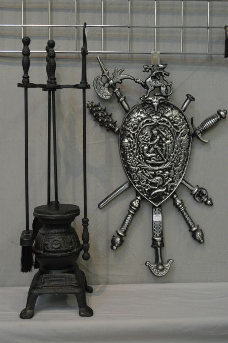 Fireside companion set and a wall plaque featuring shield and swords