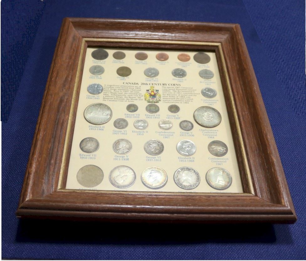Canada 20th Century Coins presented inside picture frame. This set ...