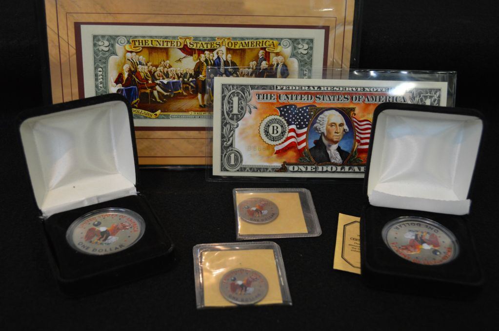 An American two dollar and one dollar colorized bills and coins