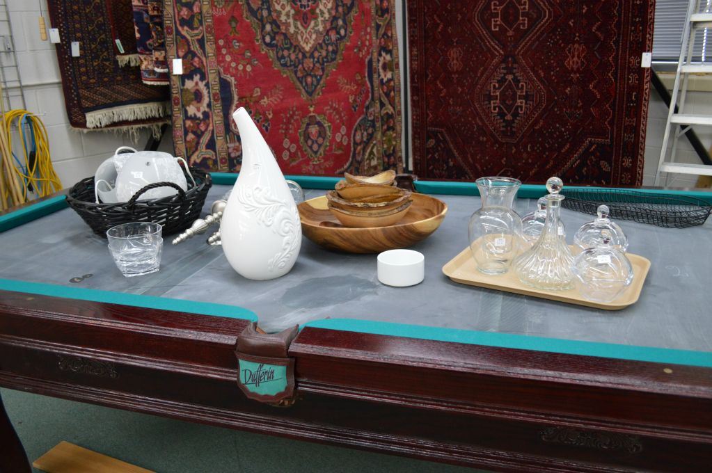 Selection of show home decor items including glassware, wooden bowls ...