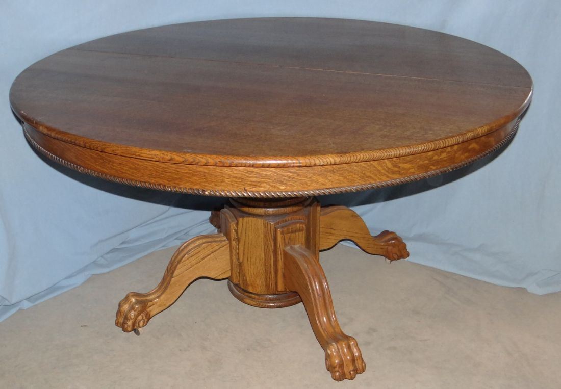 Round oak dining table, claw feet, 54”, 3 x 12” leaves, rope trim