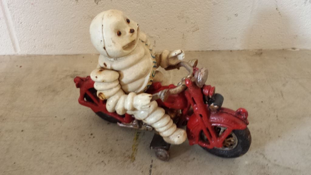 Michelin Man Riding a Motorcycle Cast Iron
