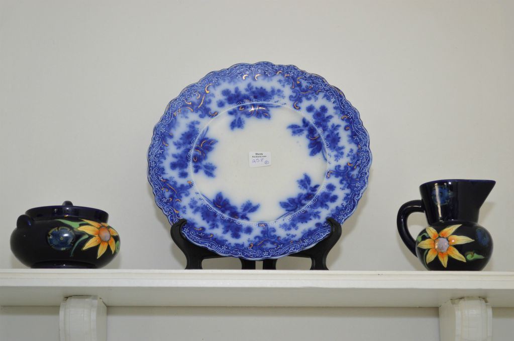 Two plates including antique flow blue plate and a hand painted floral ...