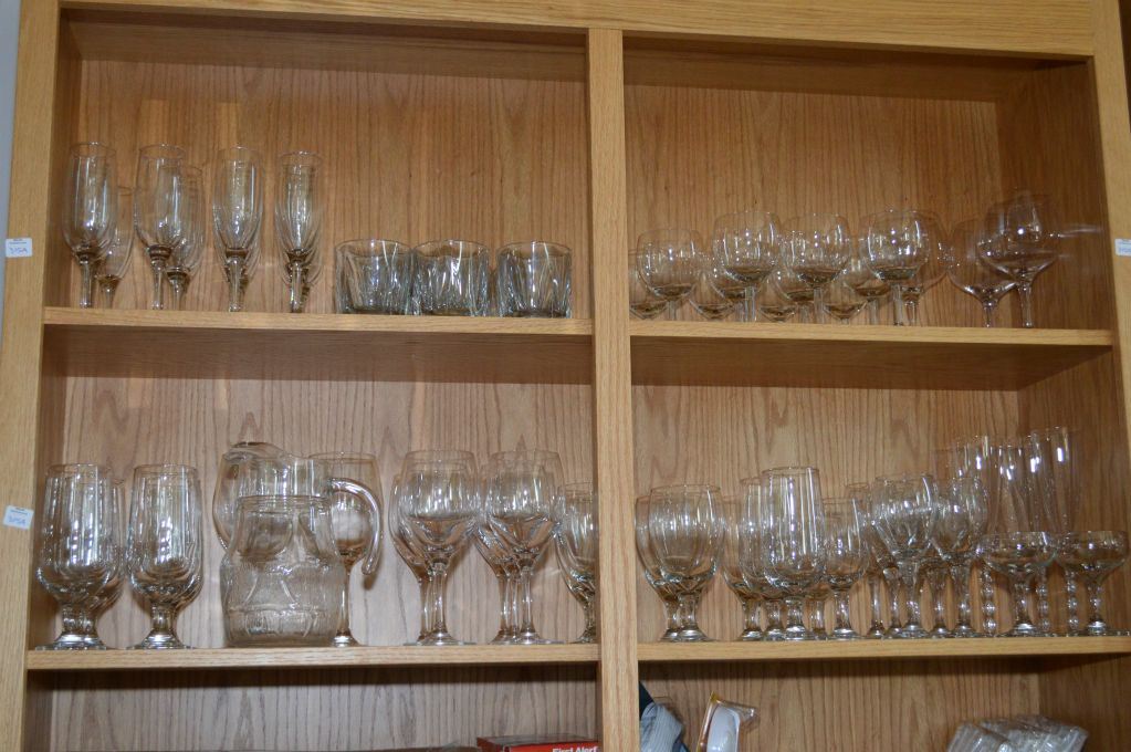 Selection of hotel glassware including wine glasses, water tumblers etc.