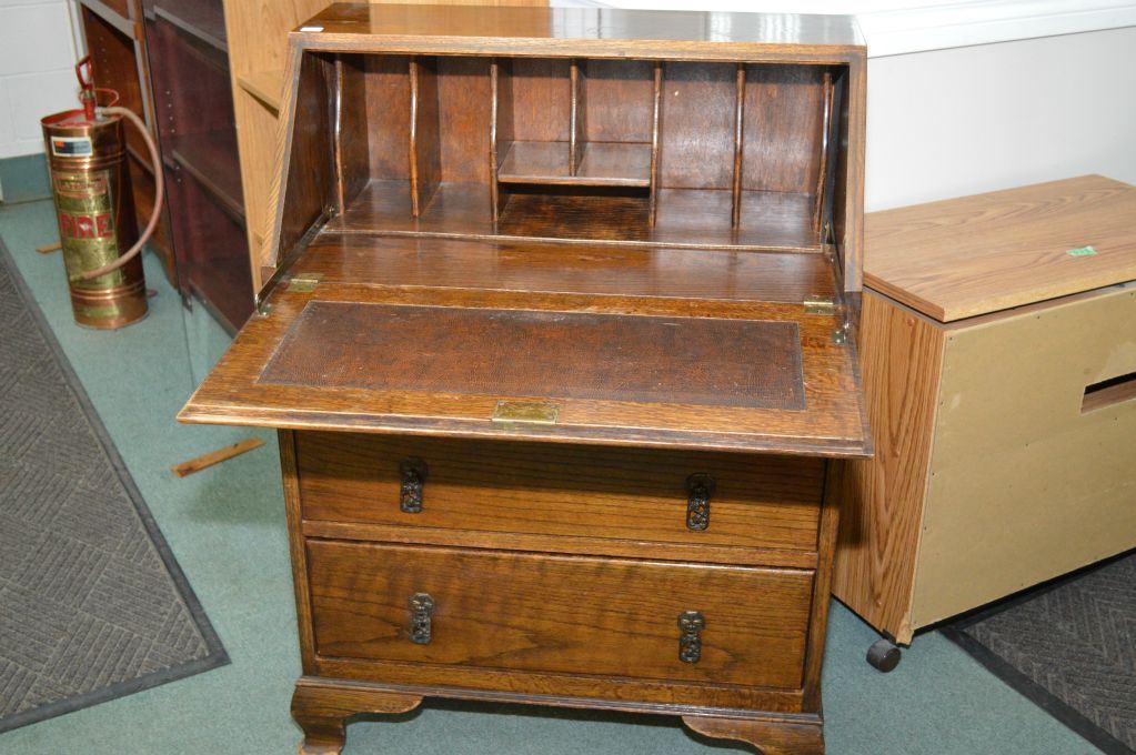 Small oak three drawer drop front desk with fitted interior
