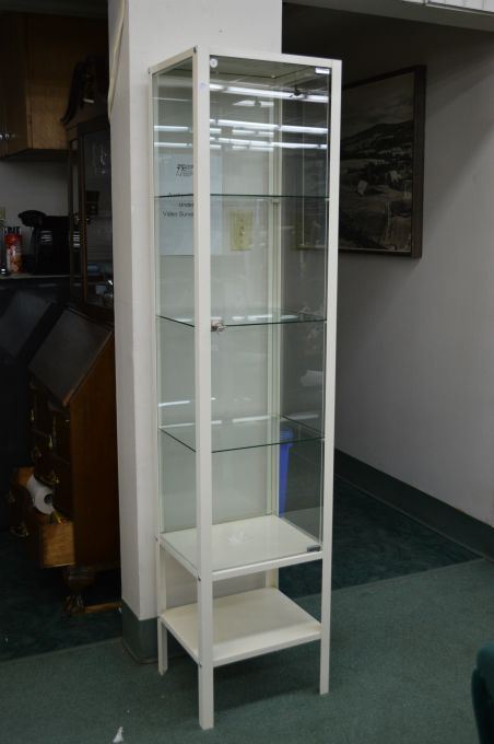 Small metal and glass retail display cabinet with single locking door