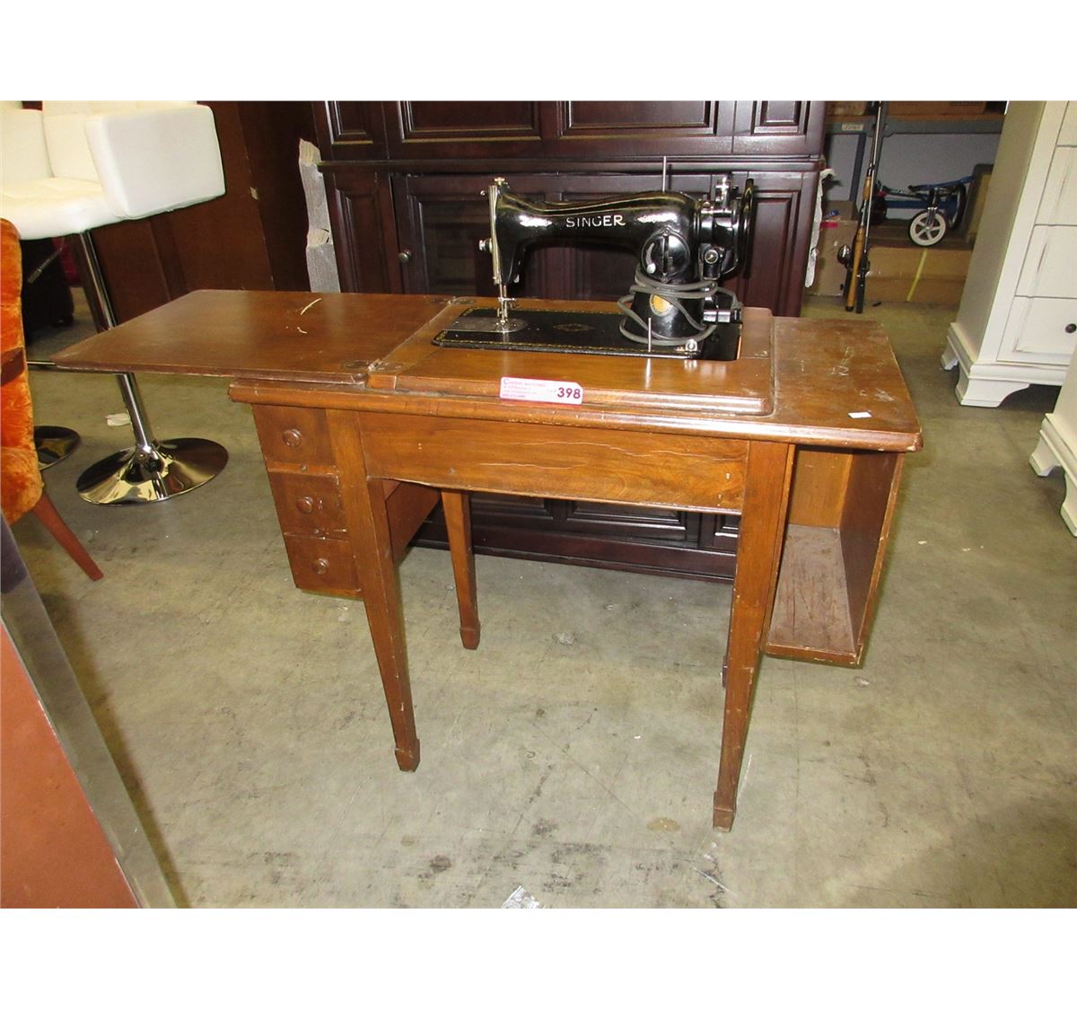 Vintage Singer sewing machine on stand.