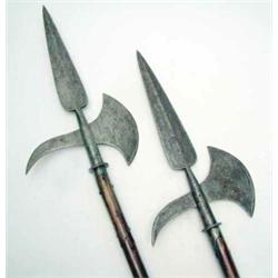 A pair of early 19th century French or German ceremonial halberds, with ...
