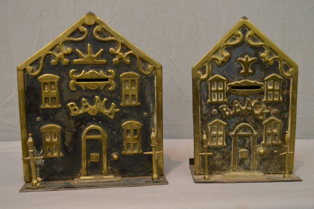 Two antique cast metal coin banks