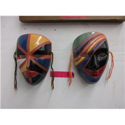 Pair of decorative painted clay wall masks