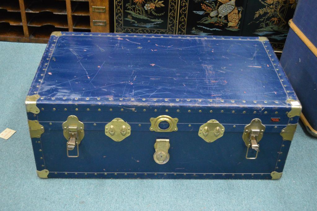 Blue steamer trunk with metal binders