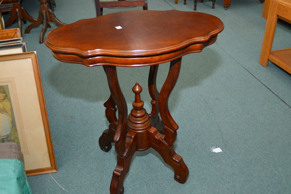 Antique style parlour table with center finial decoration