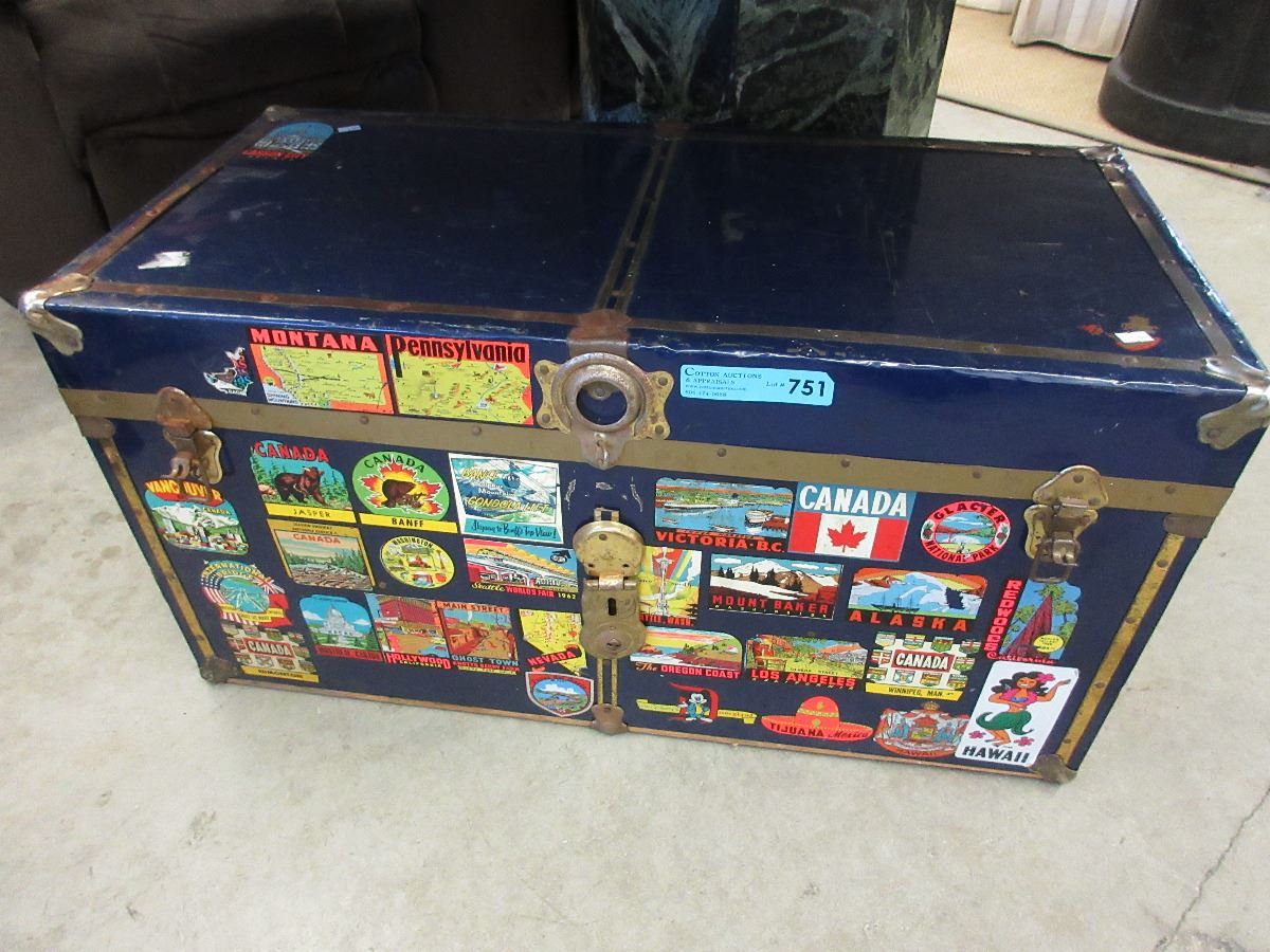 Vintage metal trunk with travel stickers