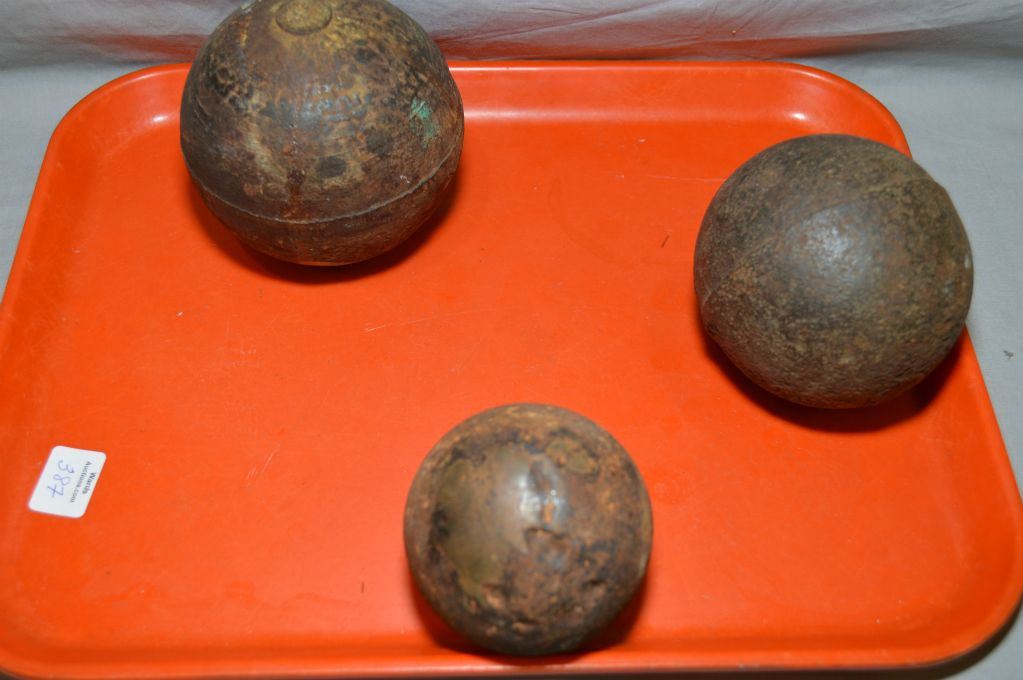 Three antique cannon balls