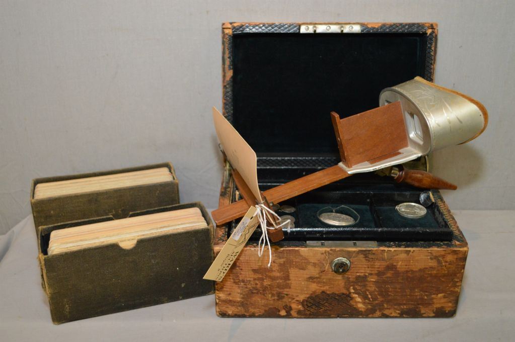 Antique stereoscope with two boxes of cards and an antique travel box ...