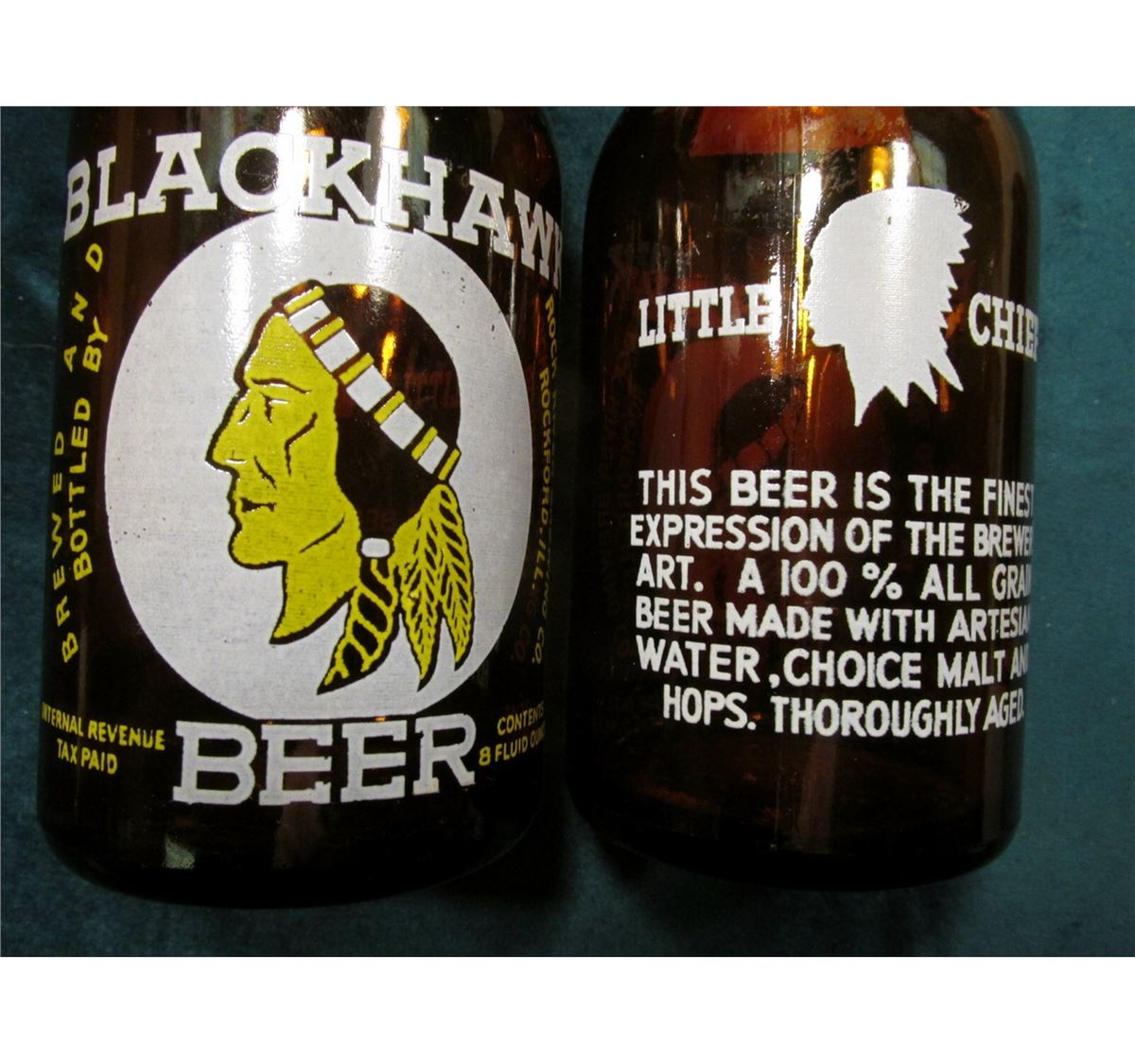(2) Amber colored bottles labeled "Blackhawk Beer Rock River Brewing Co ...