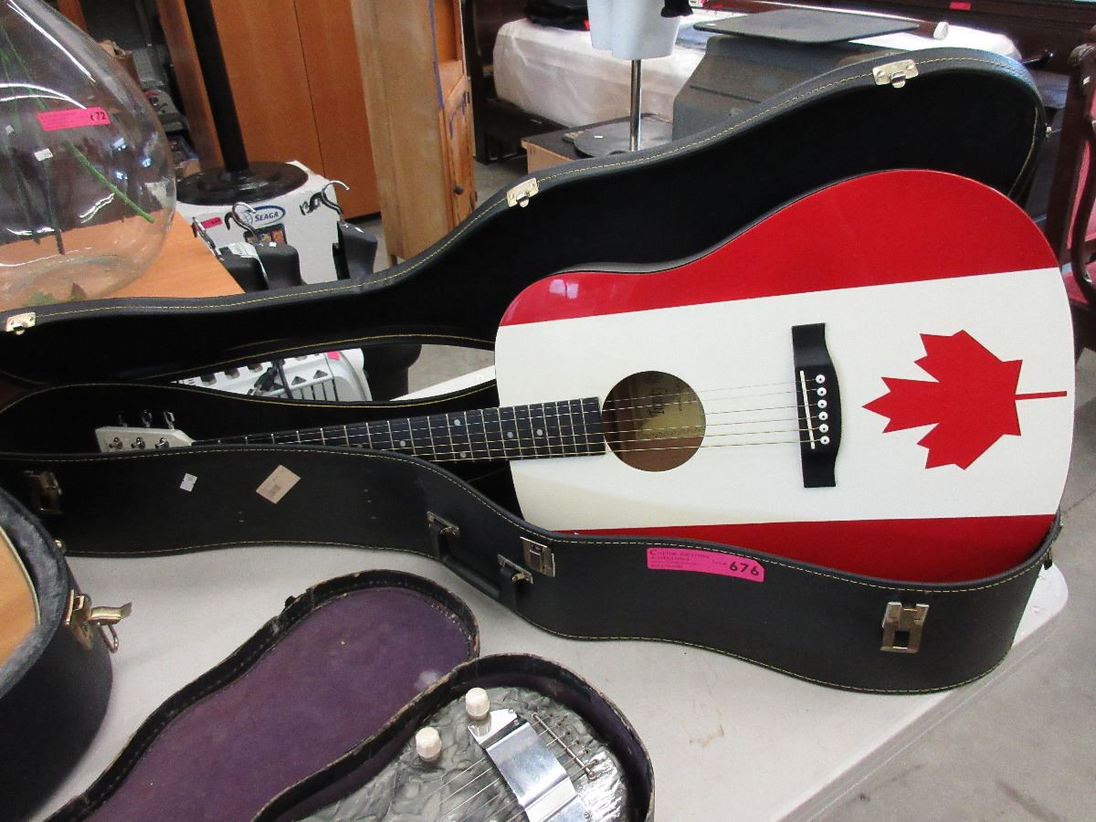 Trinity River acoustic guitar with Maple Leaf logo
