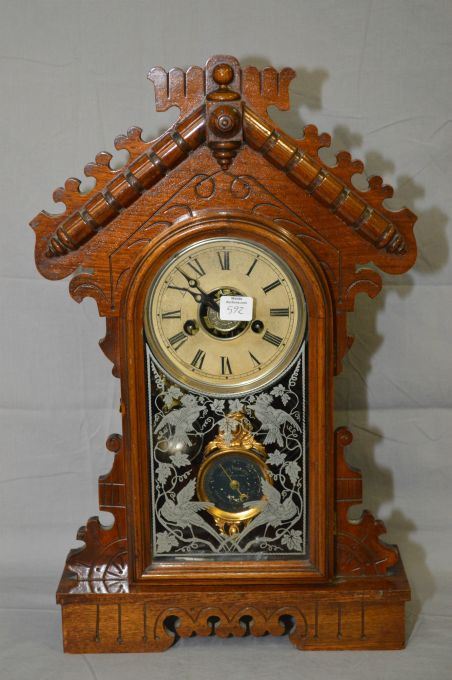 Antique Forestville gingerbread clock with a regulator pendulum and ...