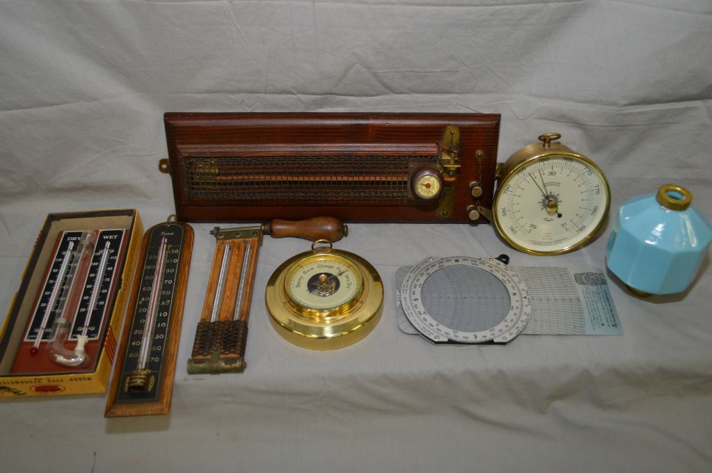 Selection of vintage weather instruments including barometer ...