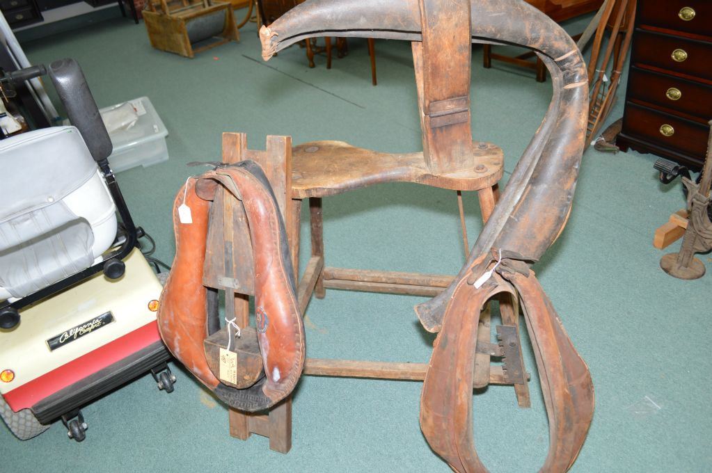 Antique leather working bench, a horse collar stretcher and a selection ...