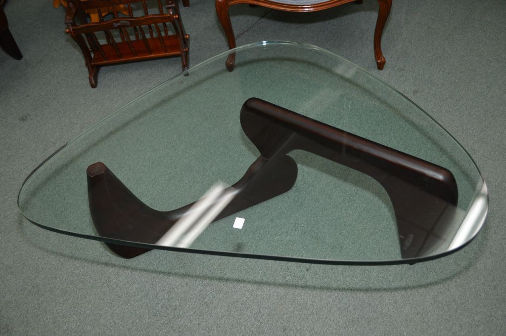 Kidney shaped modern coffee table with glass top and wooden frame