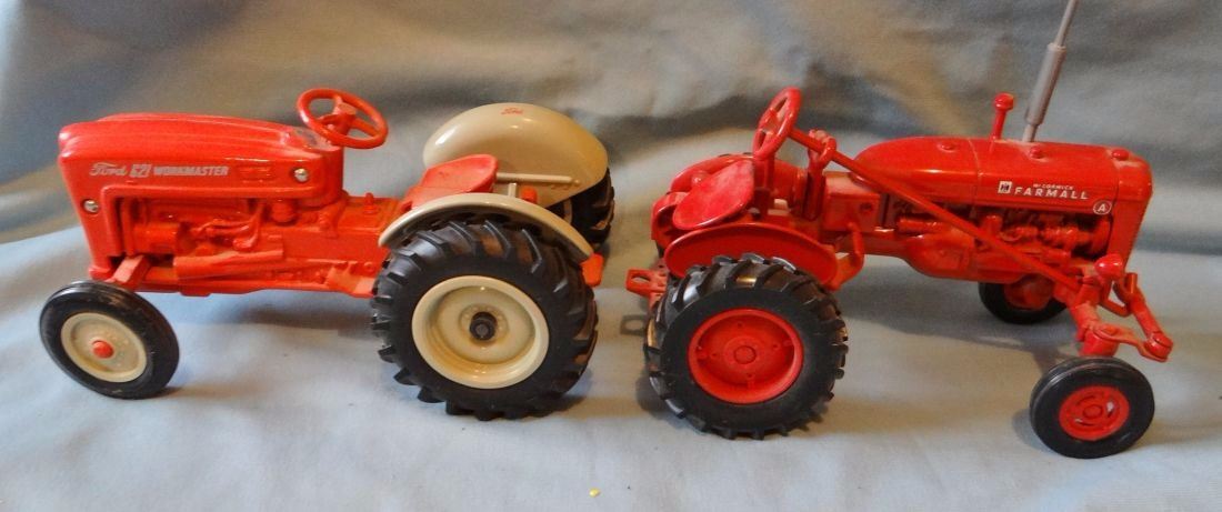 ERTL Ford 621 Workmaster & McCormick Farmall Model A tractors, (2), 1/ ...