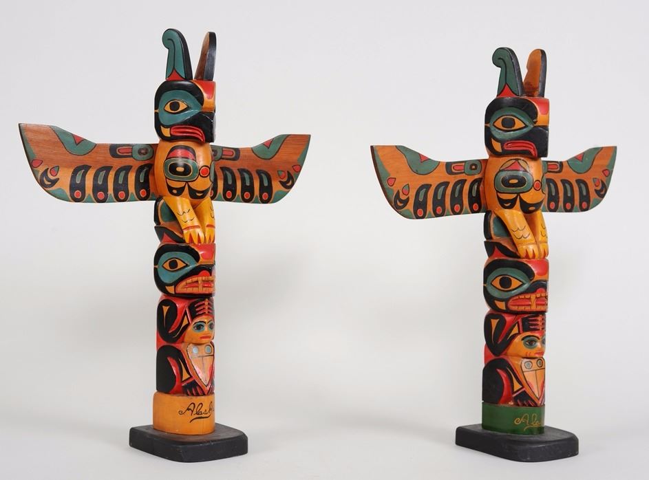 Pair of Tlingit Totems Carved with Thunderbird and Bear Holding Human ...