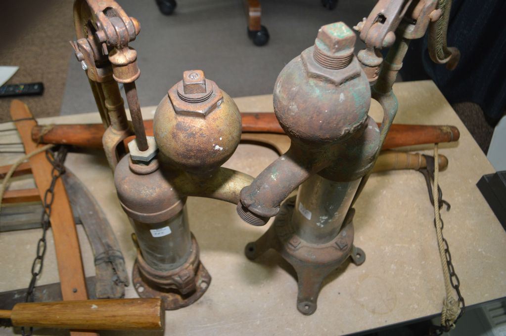 Selection of primitive collectibles including a signal triangle, saws ...