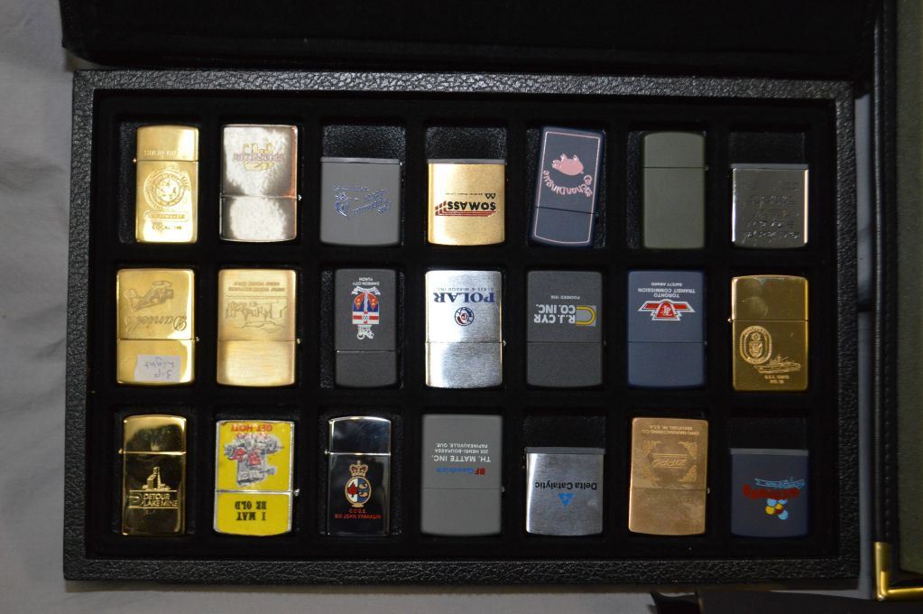 Selection of Zippo cased salesman samples including lighters, pens, key ...