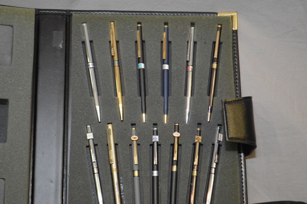 Selection of Zippo cased salesman samples including lighters, pens, key ...