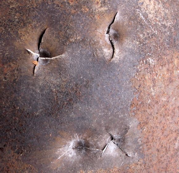 U.S. WWII M1 Helmet with Shrapnel Damage