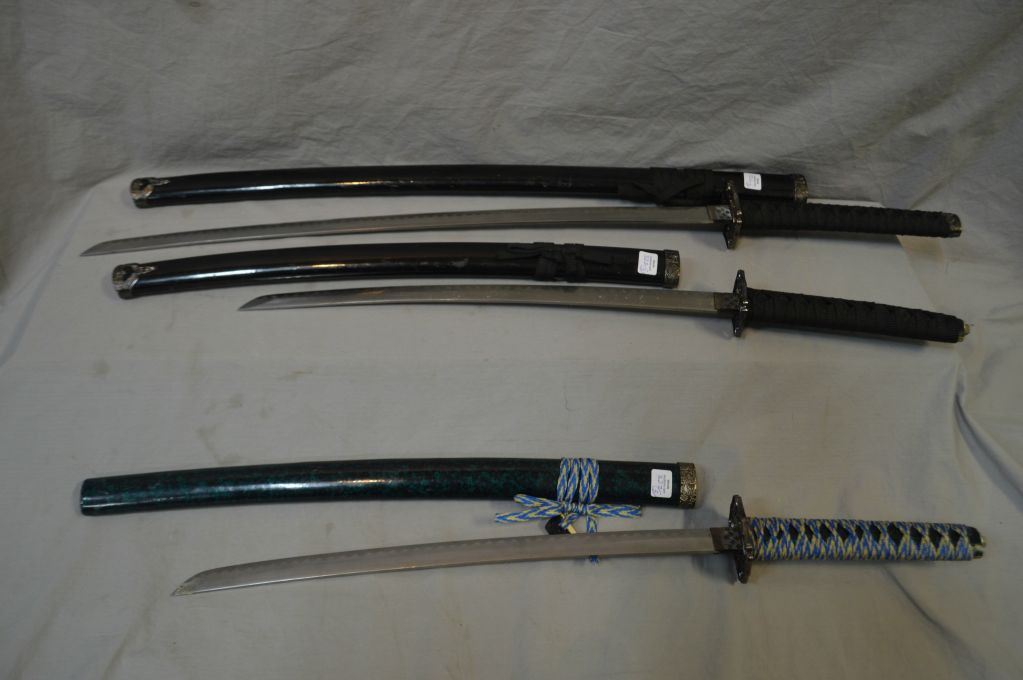 Three Asian replica Katana style swords with sheaths